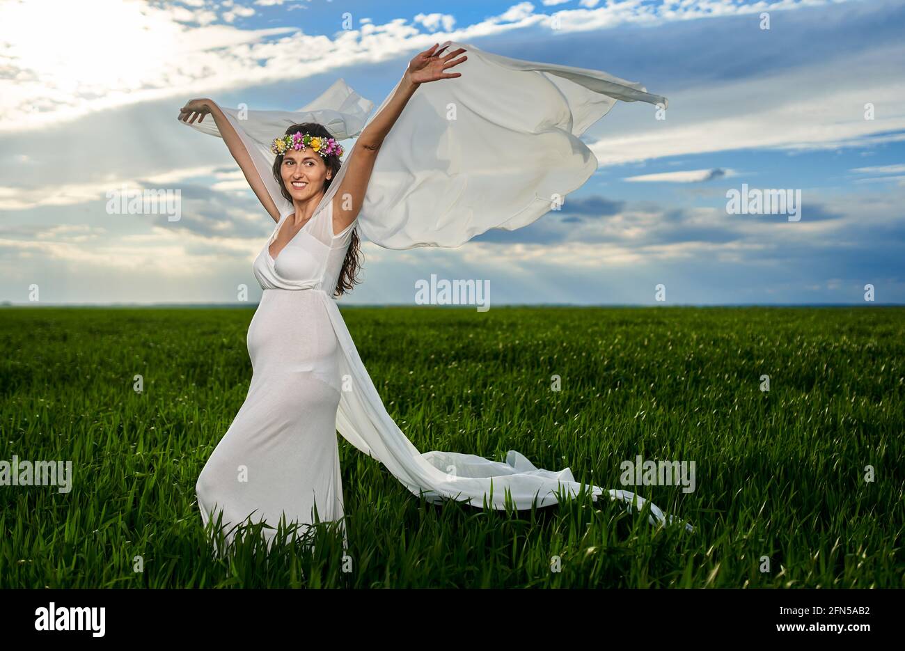 Pregnant woman flying dress hi-res stock photography and images - Alamy