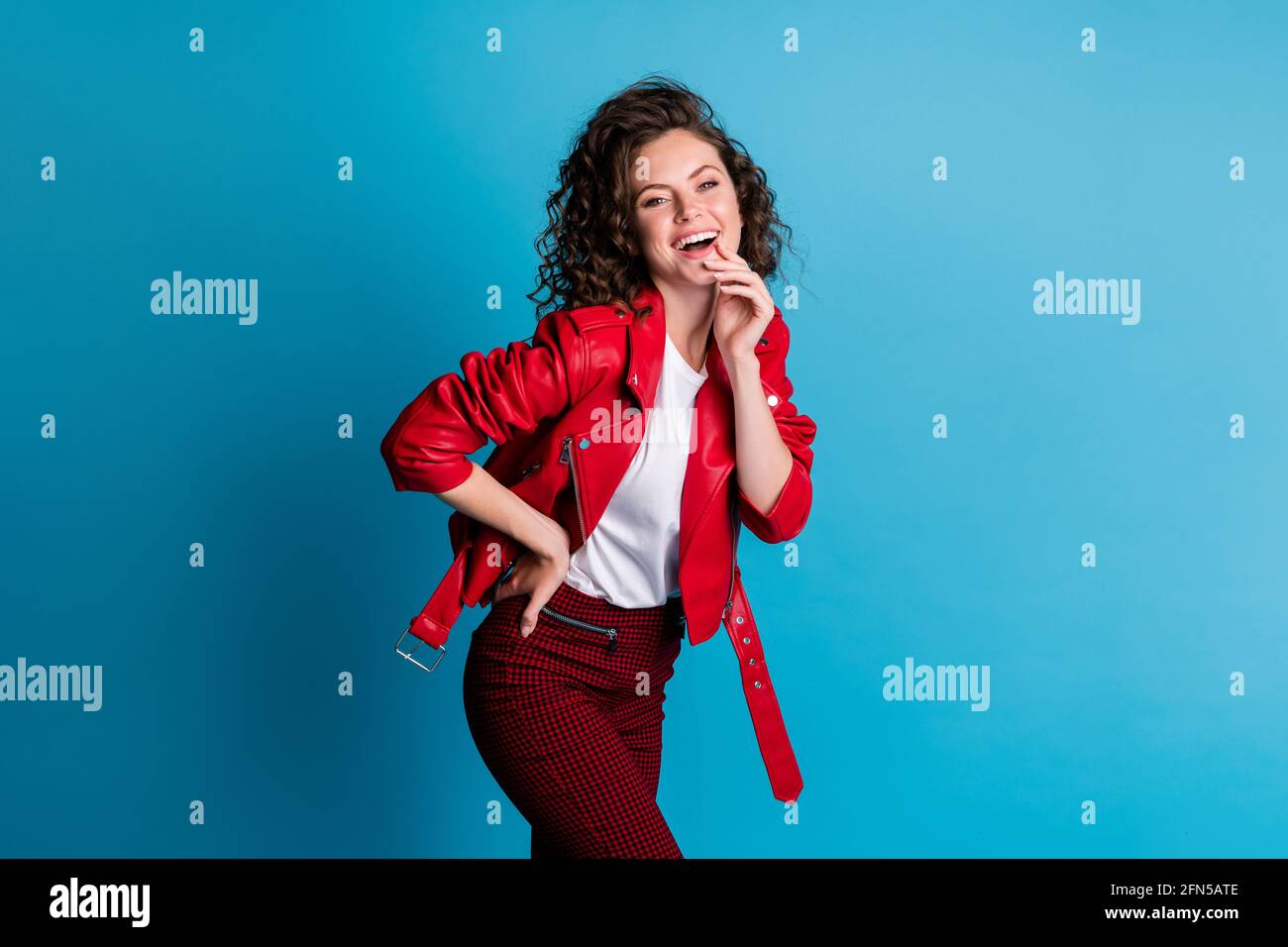 Photo of adorable funky person touch chin laughing put hand on waist ...