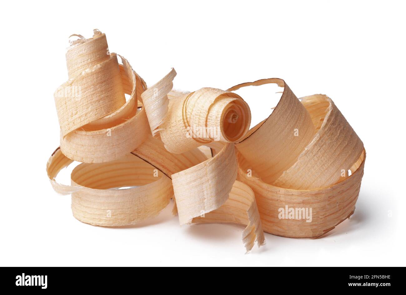 Wood shavings isolated on white background Stock Photo - Alamy