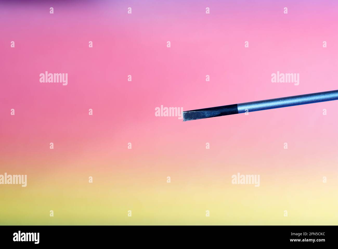 Shot of a sharp metal equipment isolated on a colorful background Stock ...