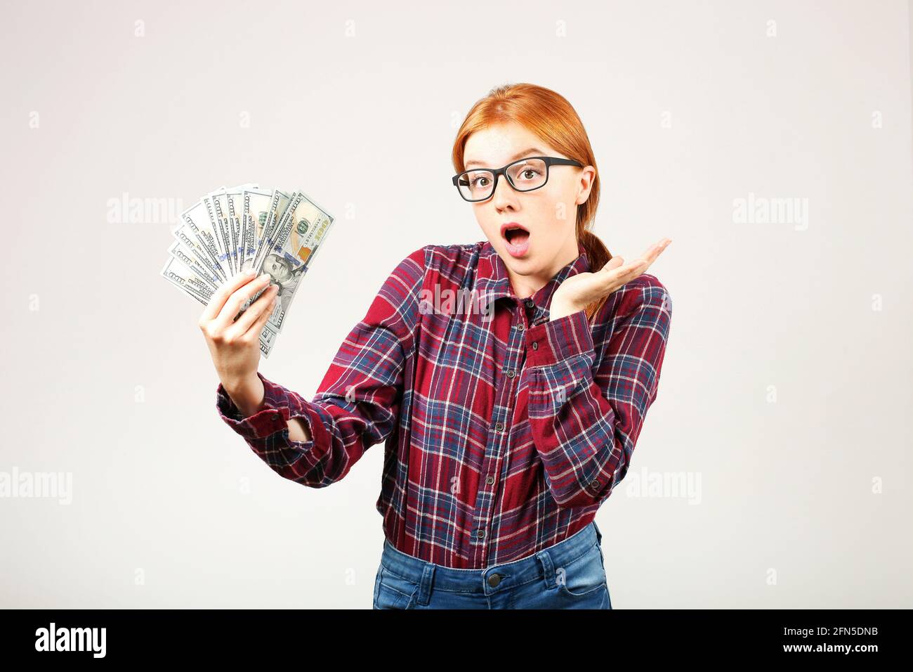 Young beautiful redhead woman screaming in rejoice, laughing w/ open ...