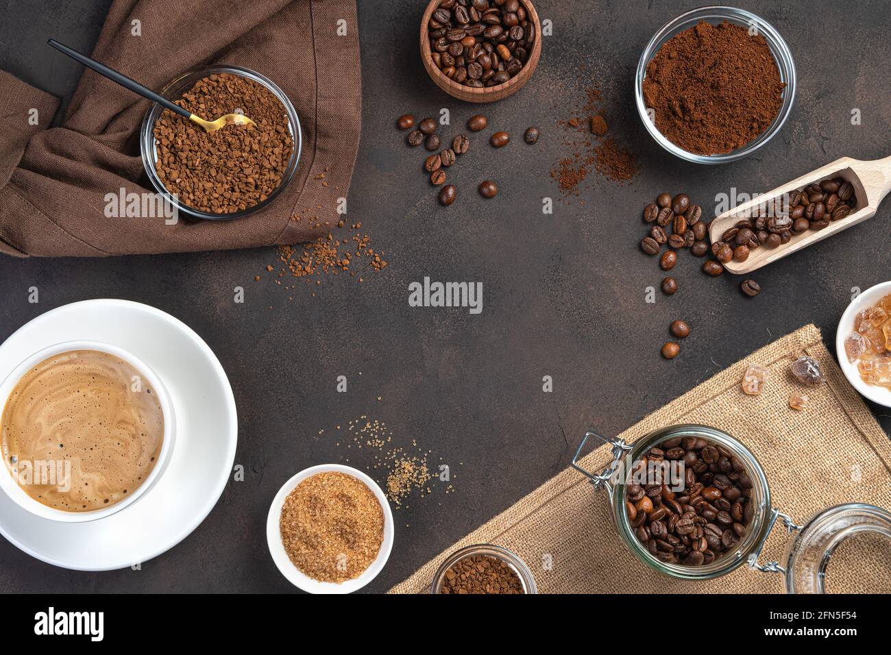 Coffee background with a cup of coffee and different types of coffee on ...
