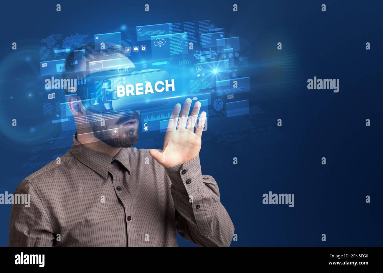 Businessman looking through Virtual Reality glasses Stock Photo - Alamy