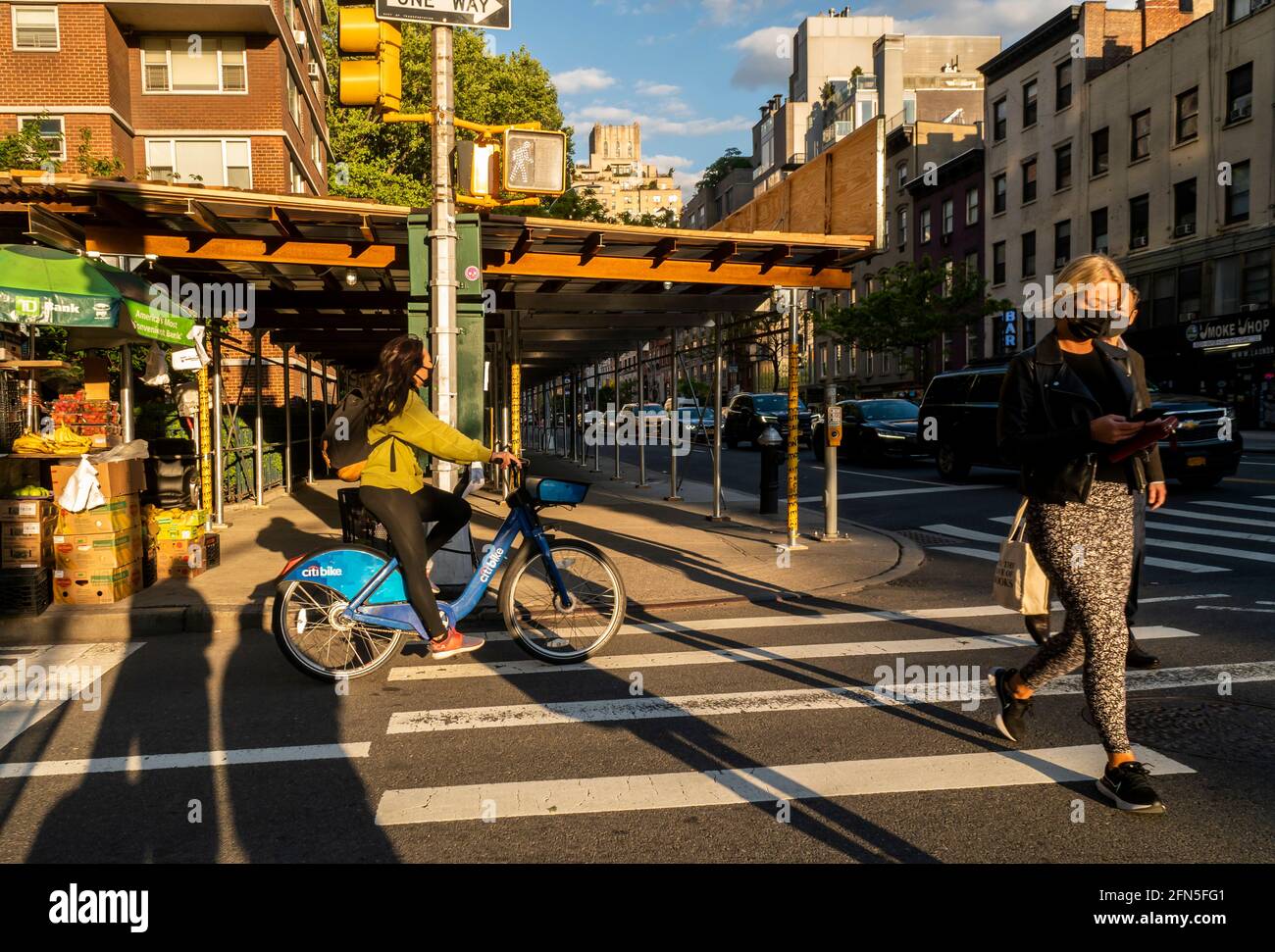 Late afternoon street corner scene with CitiBike in the Chelsea ...
