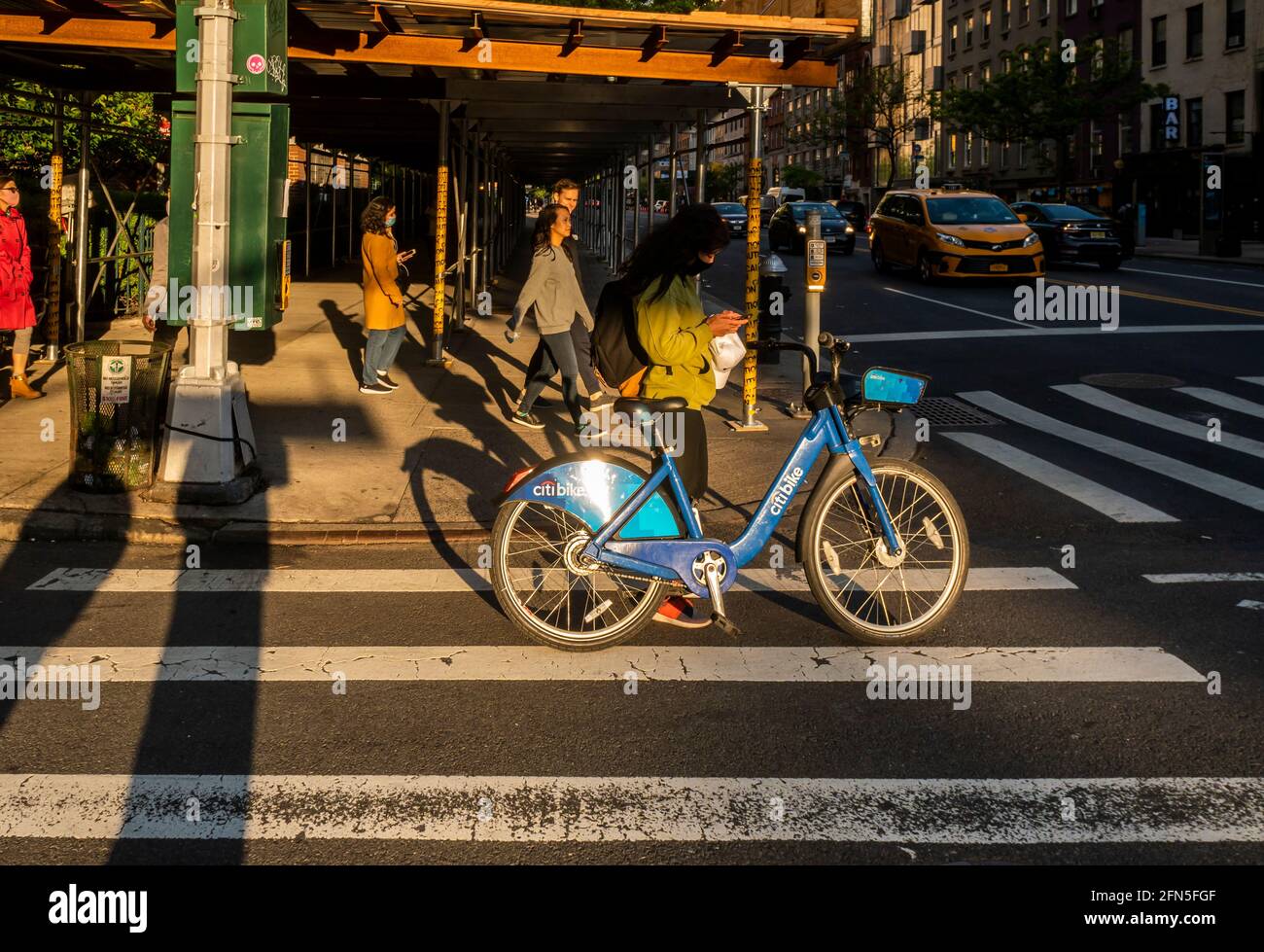 Late afternoon street corner scene with CitiBike in the Chelsea ...
