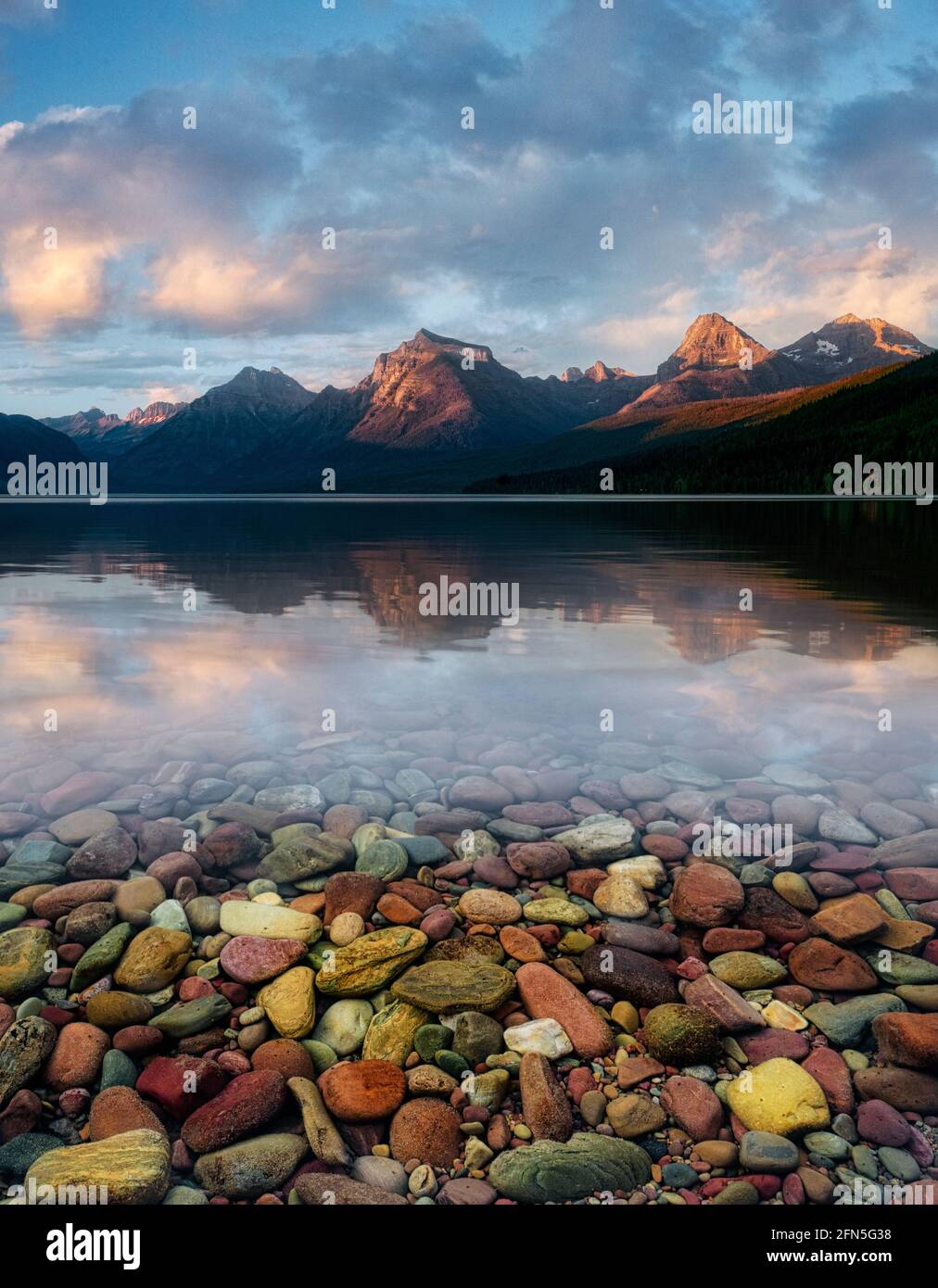 Lake McDonald with colorful rocks and sunset. Glacier National Park ...