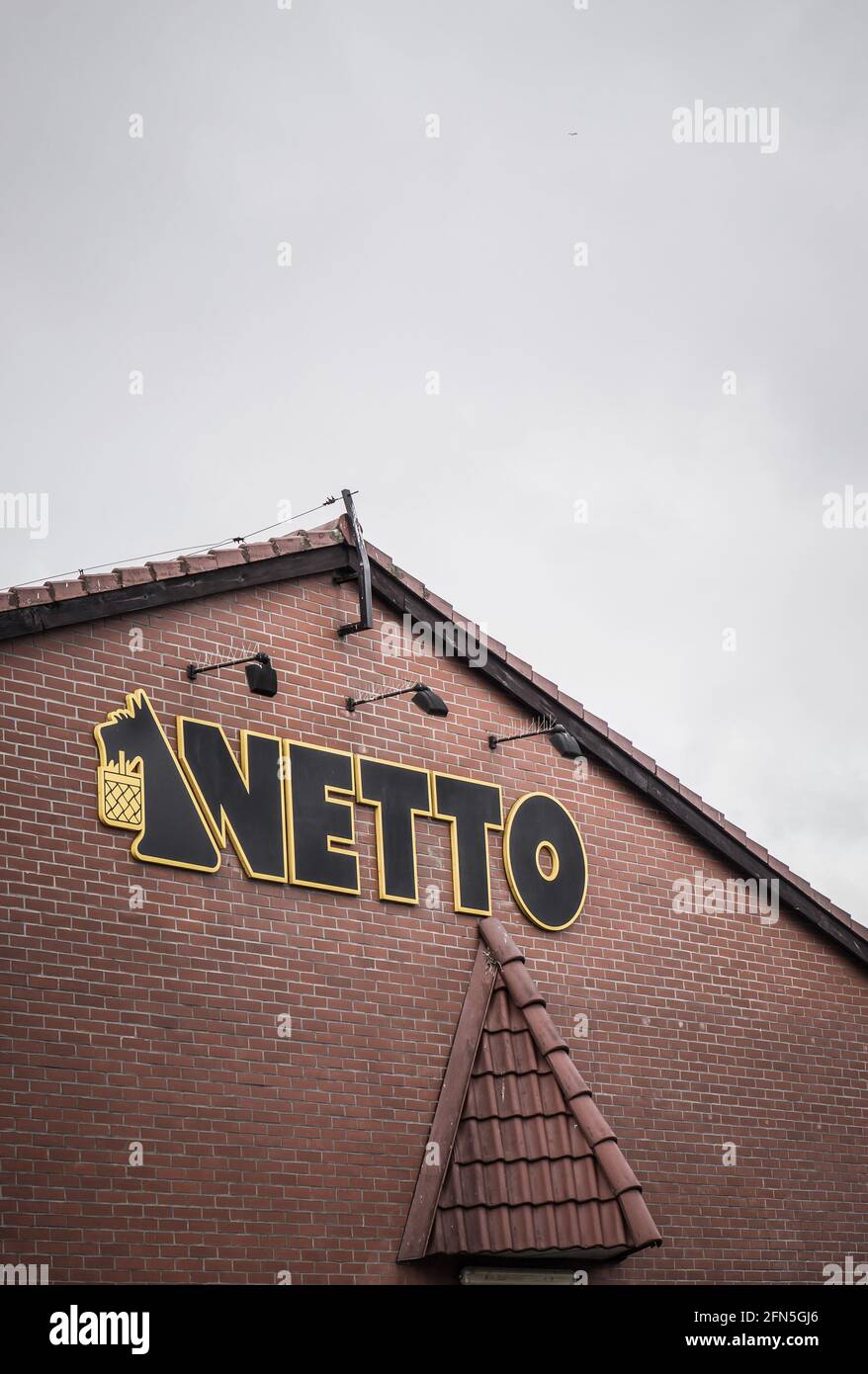 POZNAN, POLAND - Oct 17, 2016: Top of a Netto supermarket building with ...