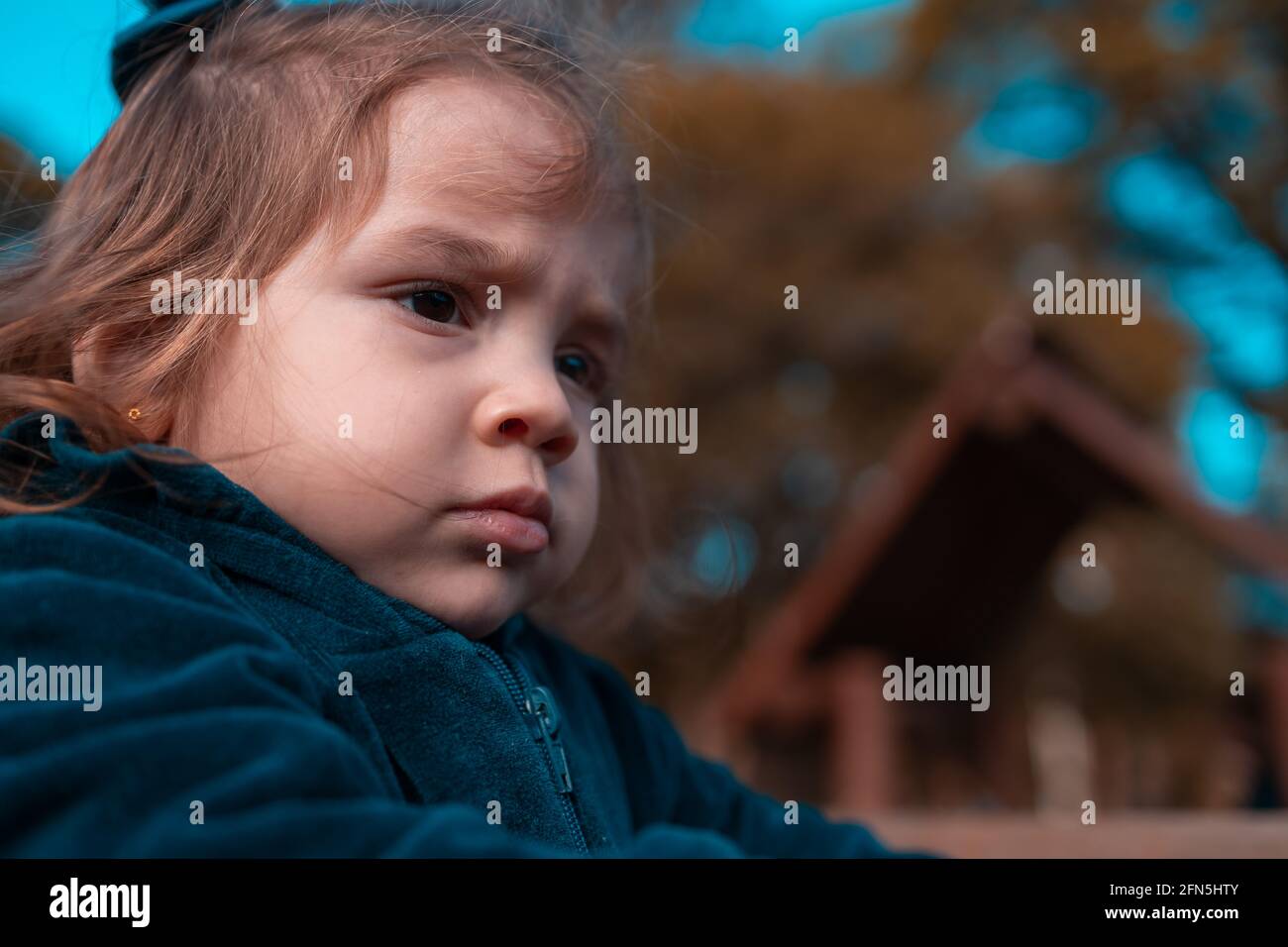 portrait of a pretty serious toddler girl Stock Photo - Alamy