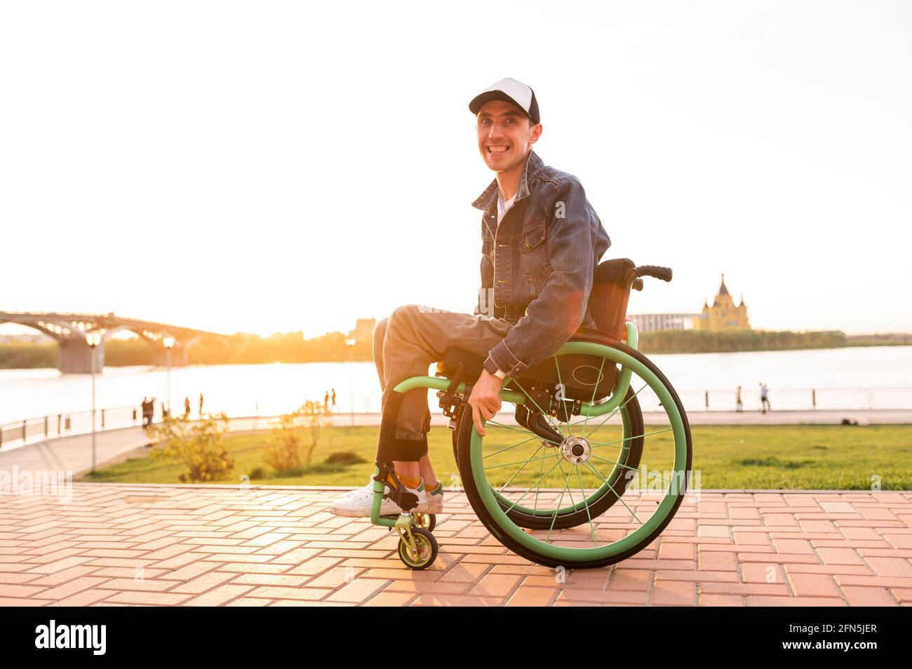 disabled young guy in a wheelchair. Disabled person in a wheelchair for ...