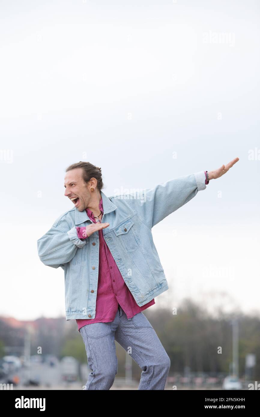 portrait of young man in 1980s style dancing in the street Stock Photo ...