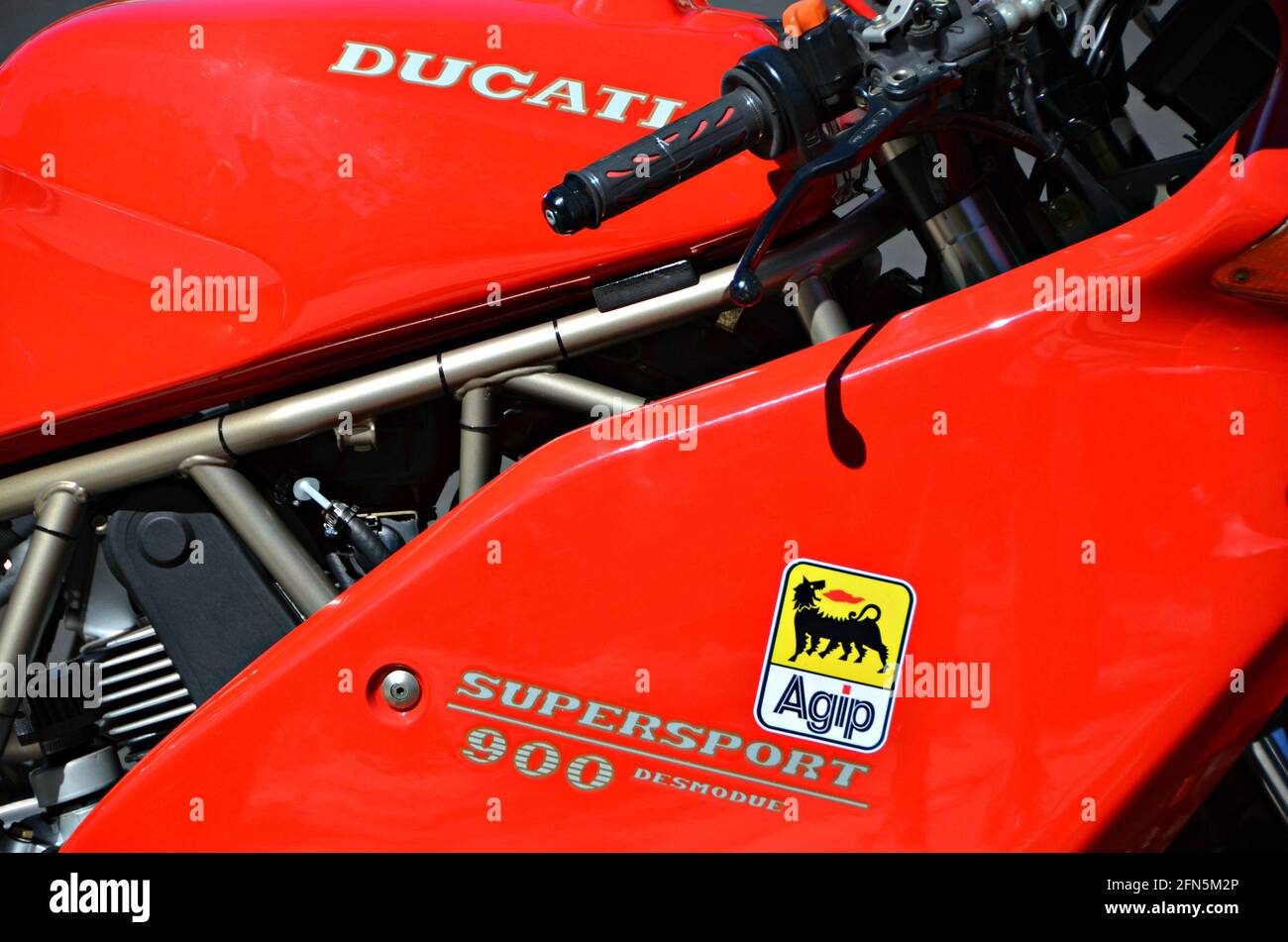 Close-up view of the fire red Ducati SuperSport 900SS with the V-twin ...