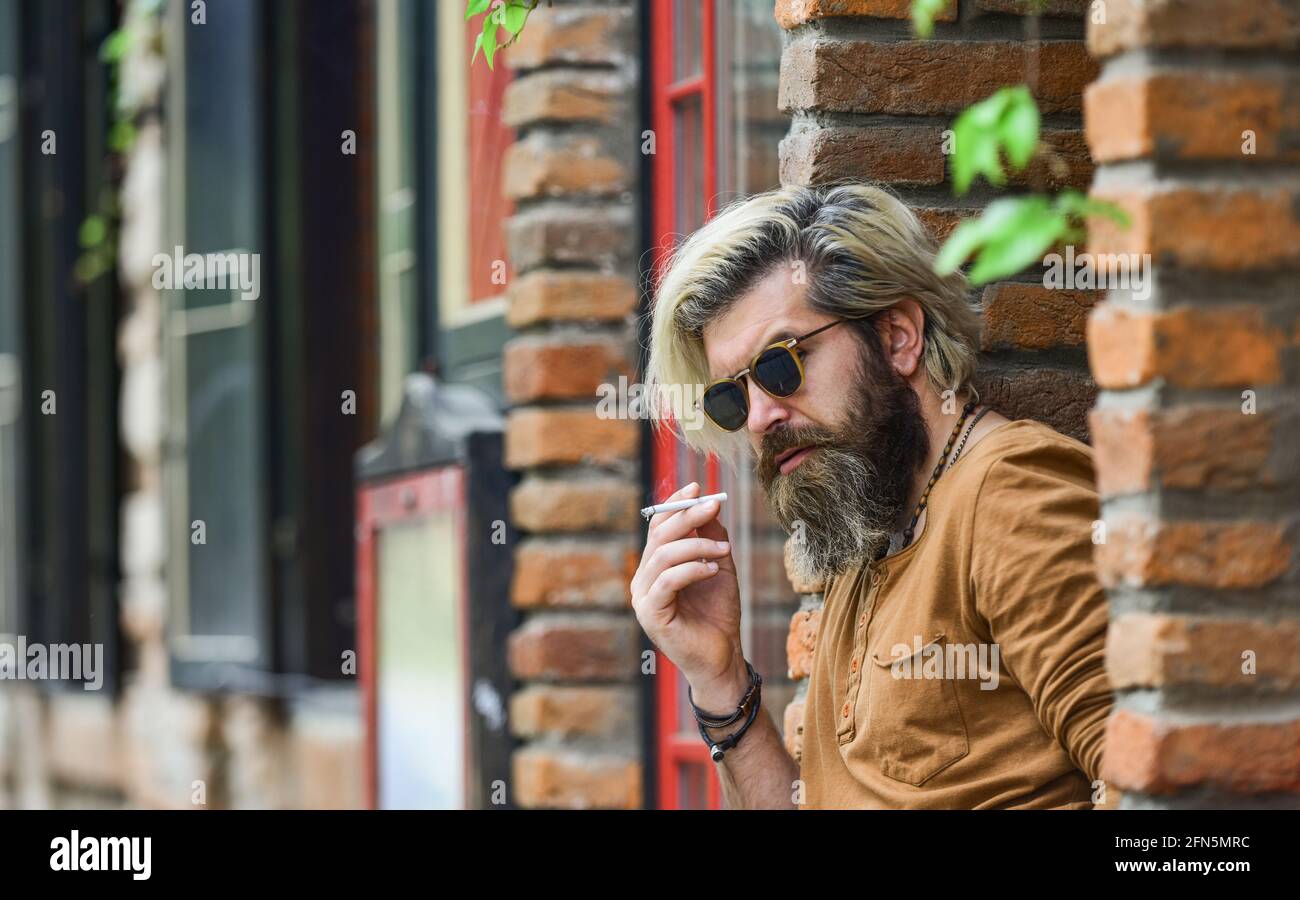 brutal mature hipster smoking cigarette. bad habits concept. harmful ...