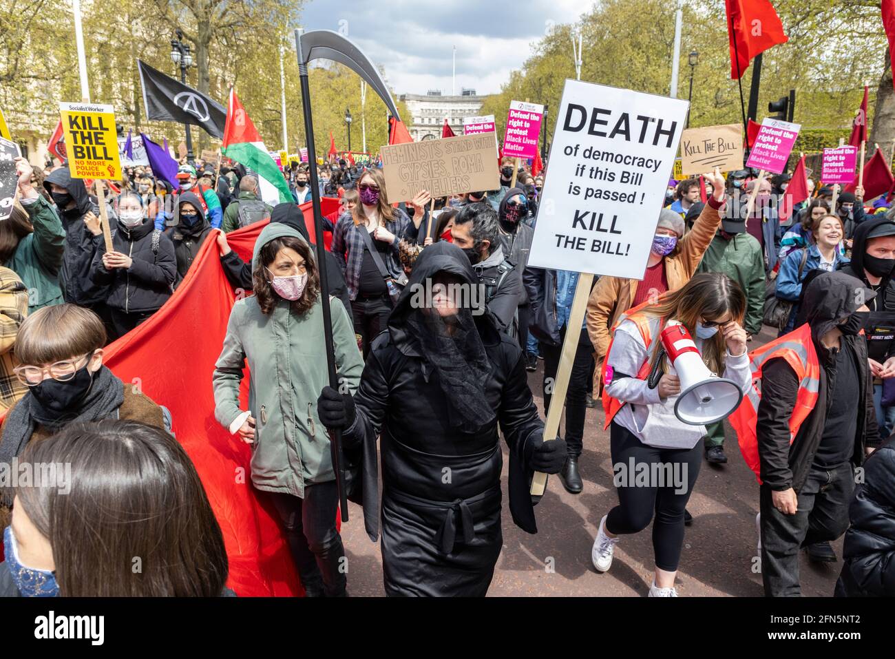 Protester in Grim Reaper costume marching with crowd at 'Kill the Bill ...