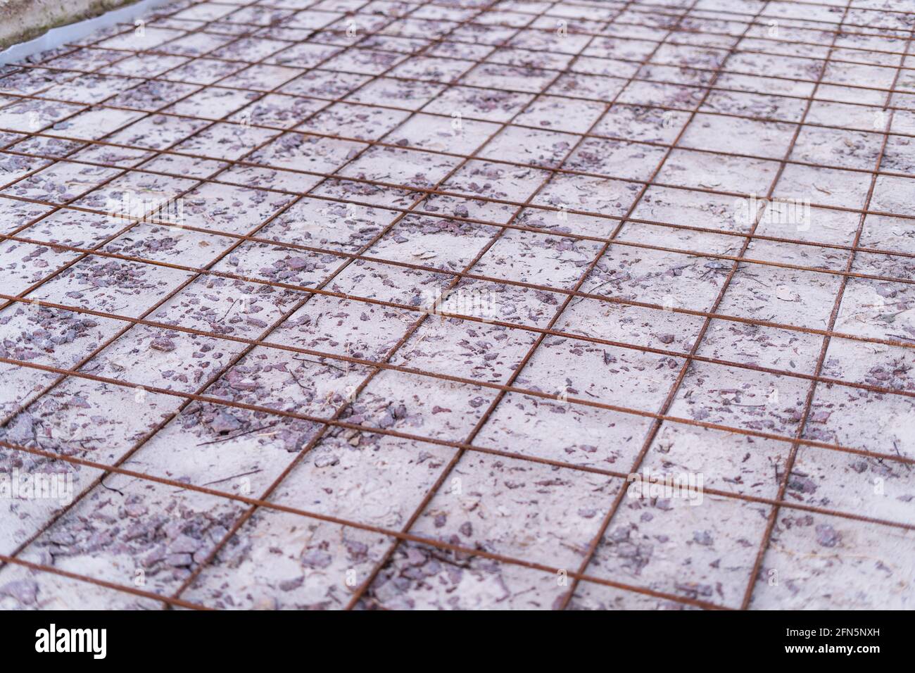 Iron reinforcement lying on the floor prepared for bonding and ...