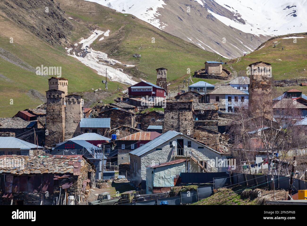 View of the Ushguli village at the foot of Mt. Shkhara. Picturesque and ...