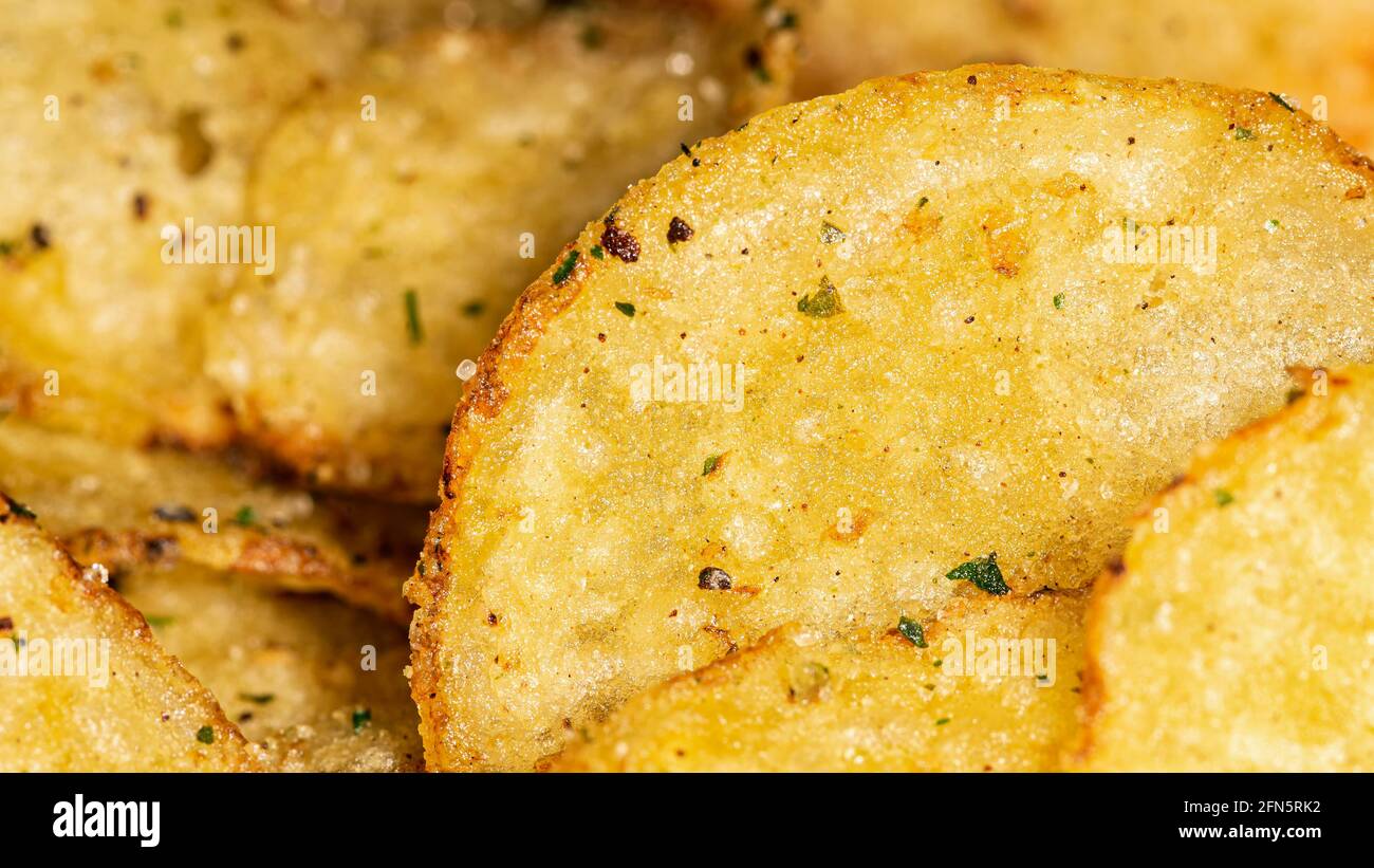 Natural fat potato chips with salt, black pepper, herbs and vegetable ...