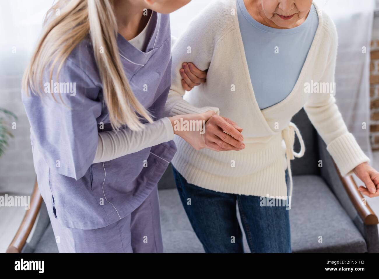 Helping elderly woman hi-res stock photography and images - Alamy