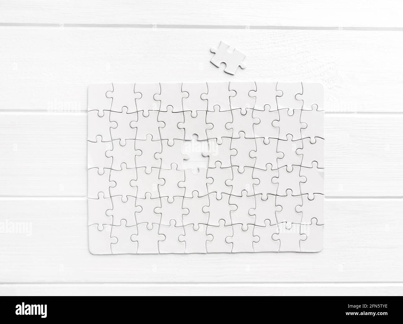 Top view of white jigsaw puzzle Stock Photo - Alamy