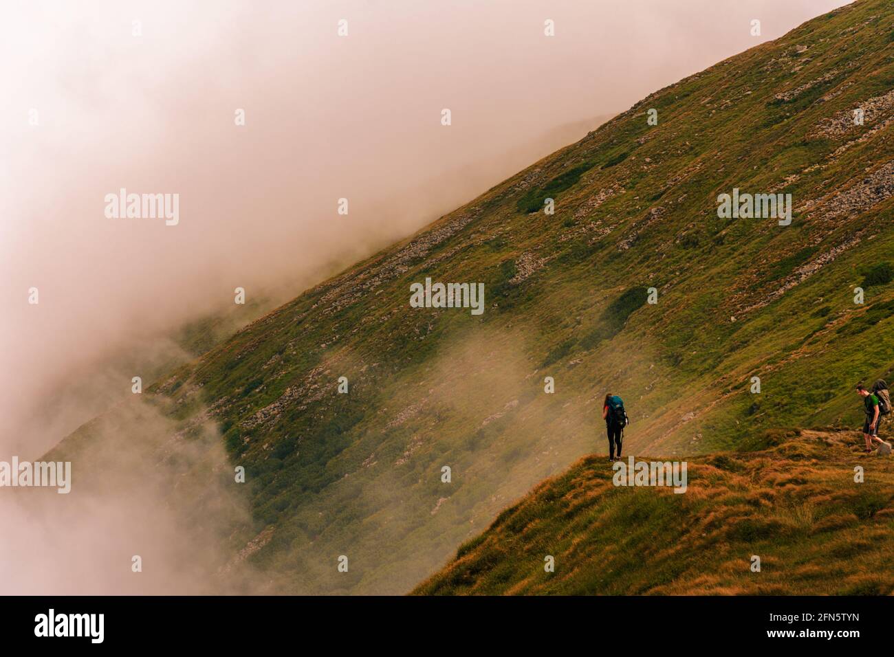 Tourists and mountains of the Montenegrin ridge, endless landscapes and ...