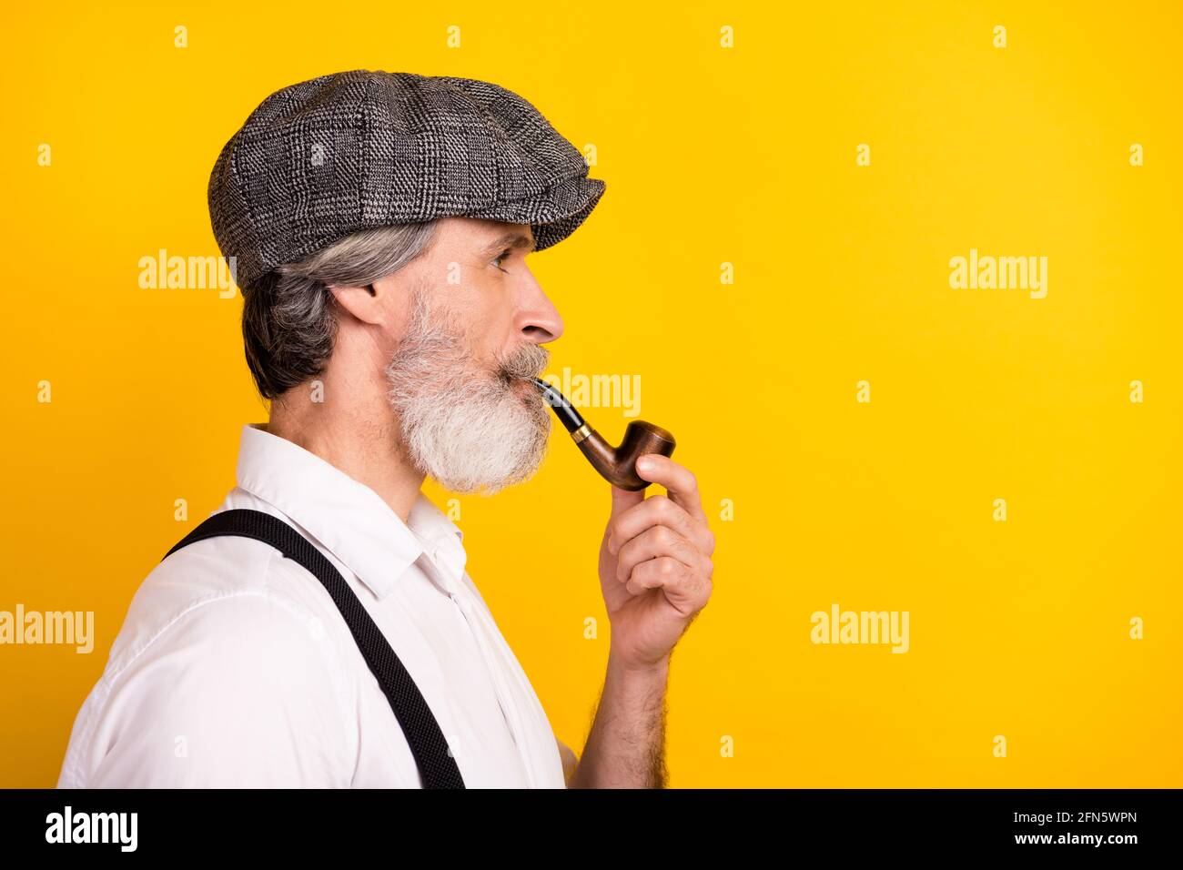 Side profile photo portrait of senior gentleman smoking tobacco wooden ...