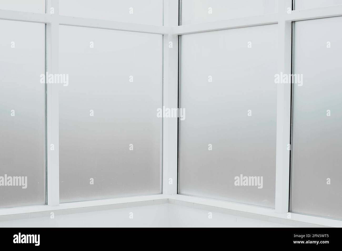 Large glass windows in a bright studio Stock Photo - Alamy
