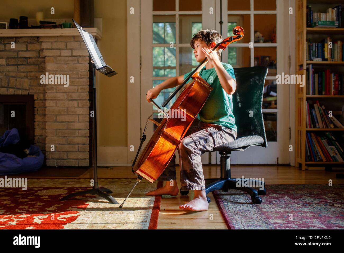 Boy musician cellist hi-res stock photography and images - Alamy
