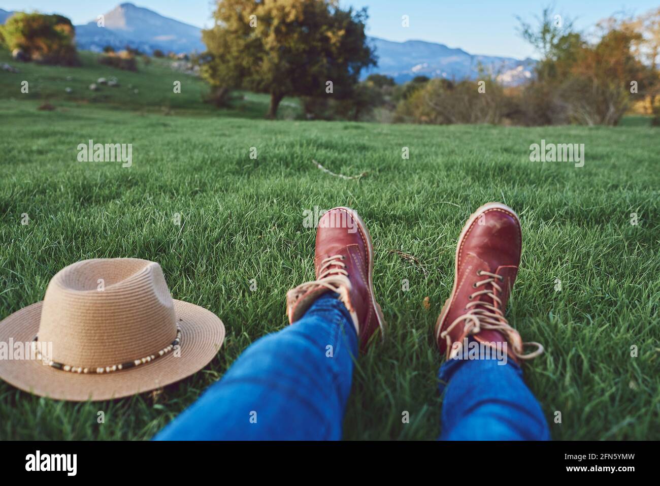 Low section of some legs with a background landscape Stock Photo - Alamy