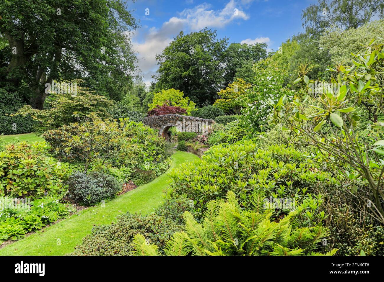 A flint Stone bridge in the grounds of Bressingham Gardens, a steam ...