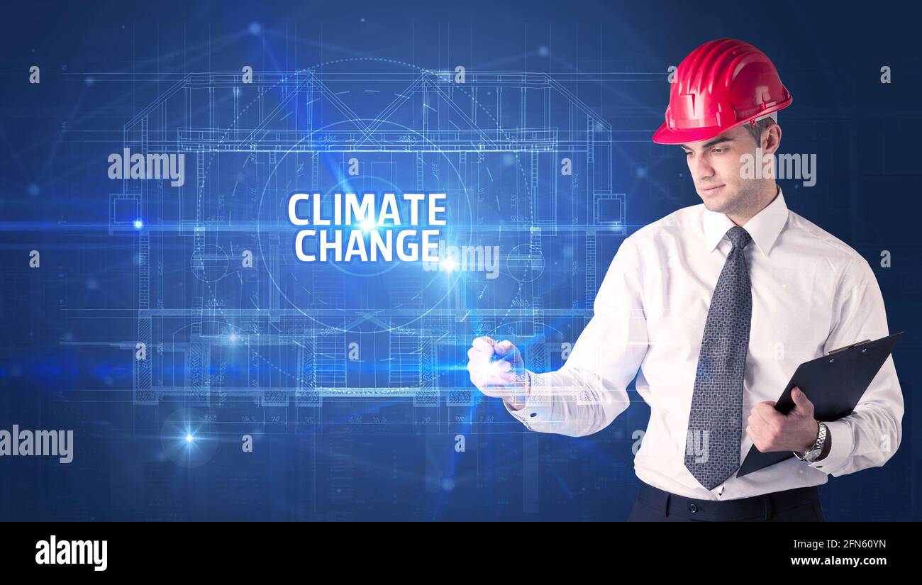 Handsome architect drawing with helmet Stock Photo - Alamy