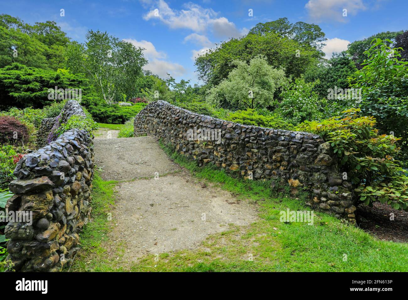 A flint Stone bridge in the grounds of Bressingham Gardens, a steam ...