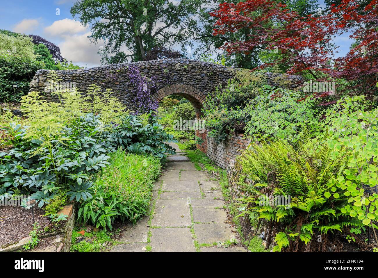 A flint Stone bridge in the grounds of Bressingham Gardens, a steam ...