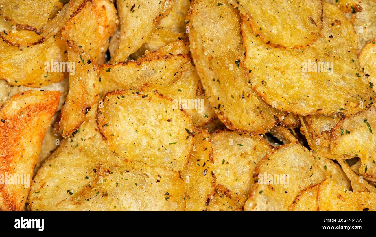 Natural fat potato chips with salt, black pepper, herbs and vegetable ...