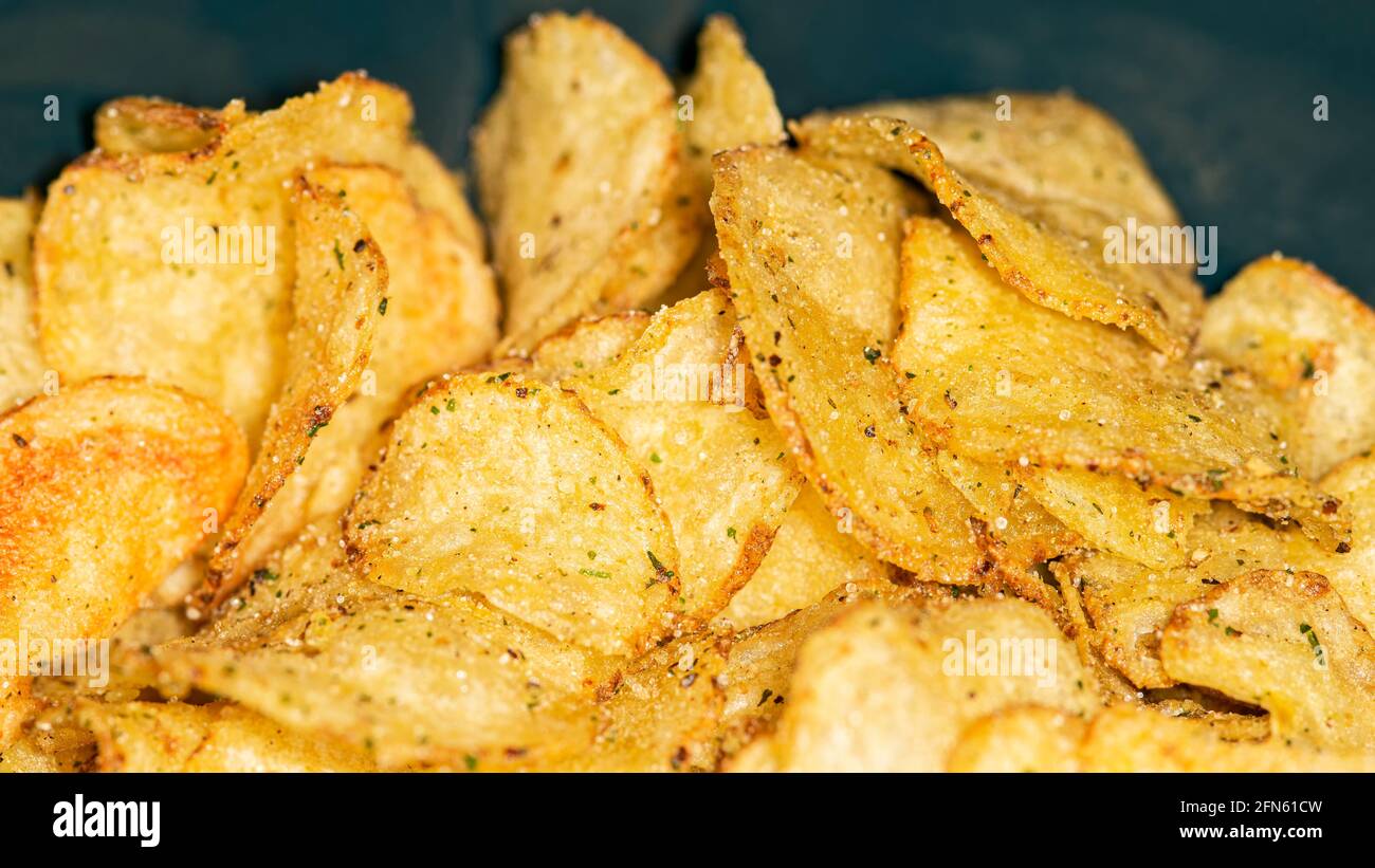 Natural fat potato chips with salt, black pepper, herbs and vegetable ...
