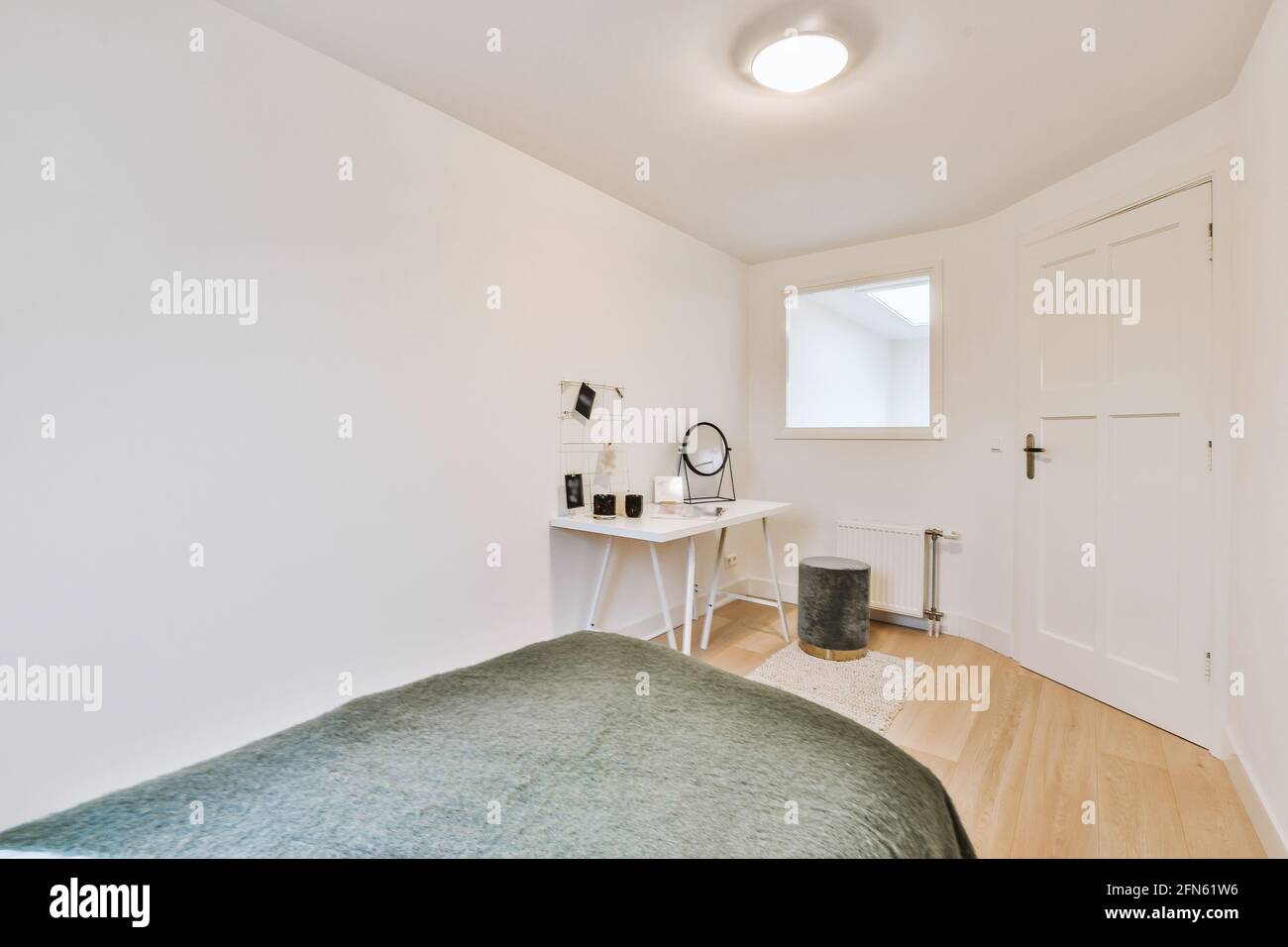 Table with makeup supplies near bed Stock Photo - Alamy