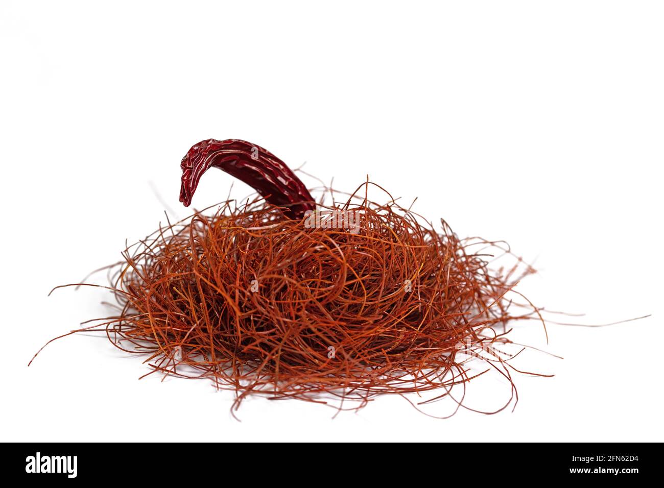 Chilli threads and chilli pod against white background Stock Photo - Alamy