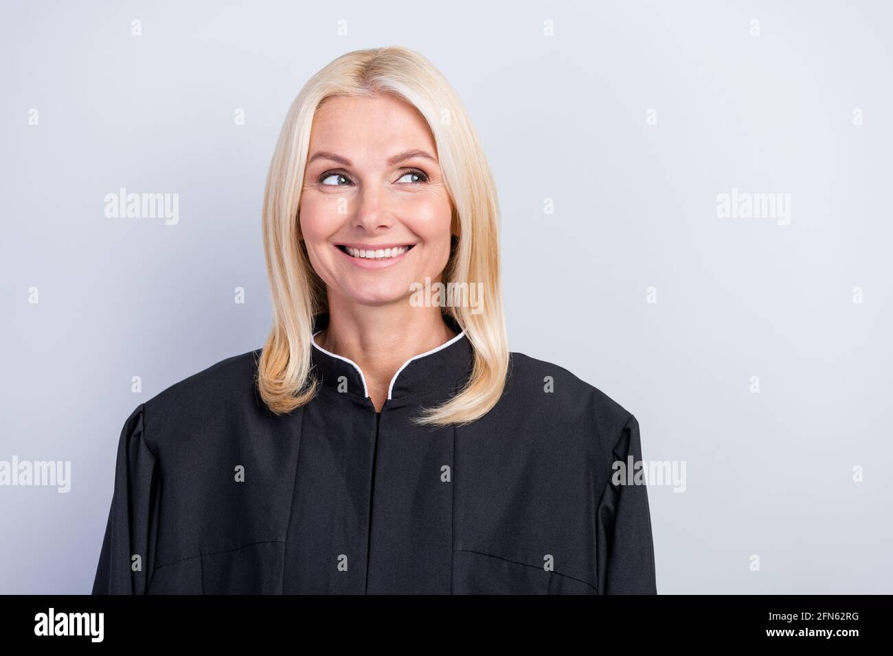 Portrait of attractive clever cheerful skilled curious woman judge ...