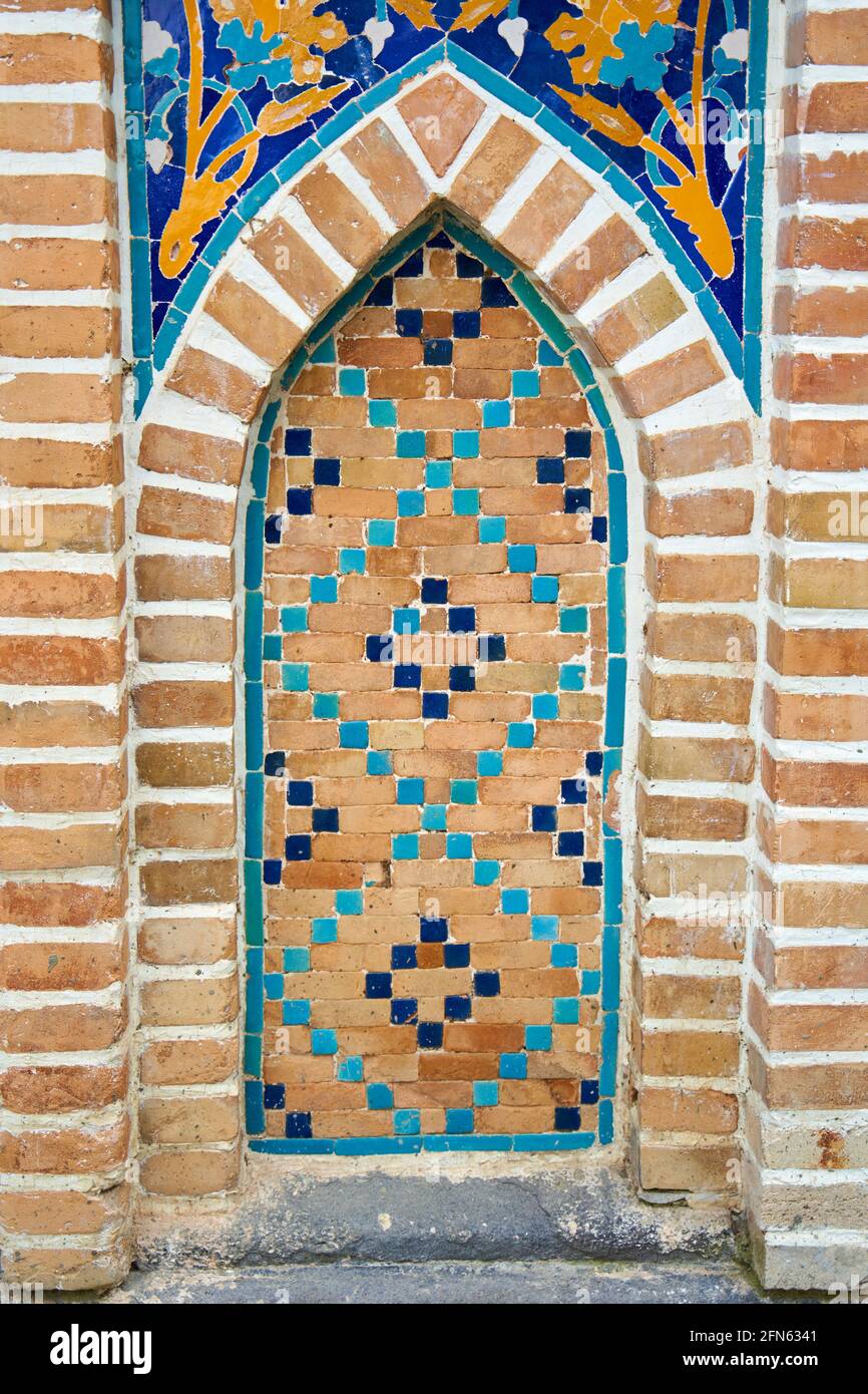 The facade of the old Turkish bath building is lined with mosaics ...