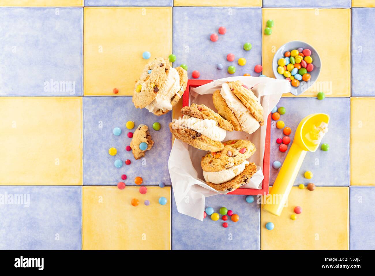 Vanilla ice cream sandwich with chocolate chip cookies and colorful ...