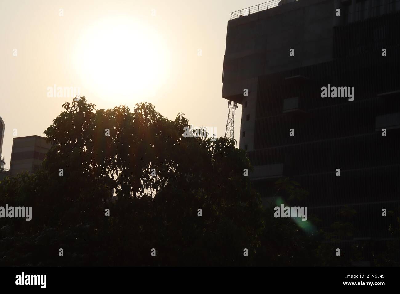 sun with building Stock Photo - Alamy