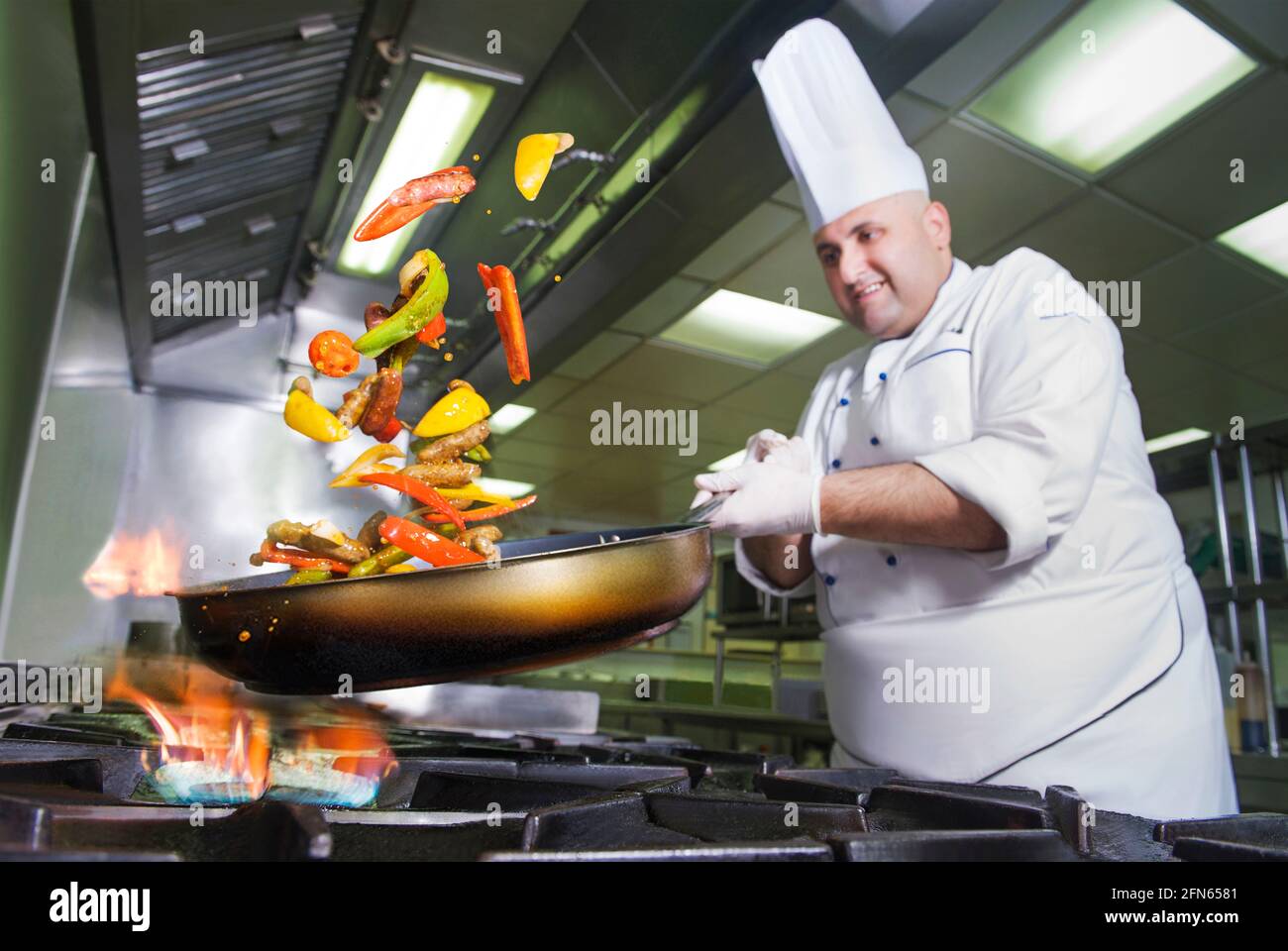 Chef tossing flame hi-res stock photography and images - Alamy
