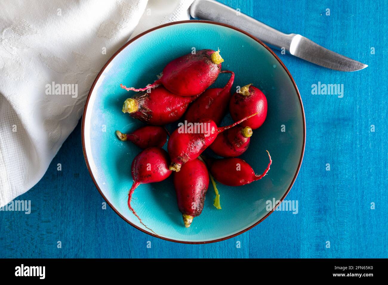 Ecological radishes (red radishes) of intense red color. Close-up from ...
