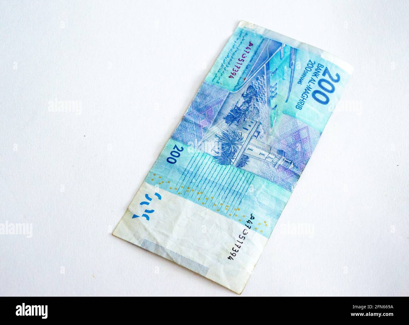A 200-note banknote of the Arab dirhams of Morocco on a white ...