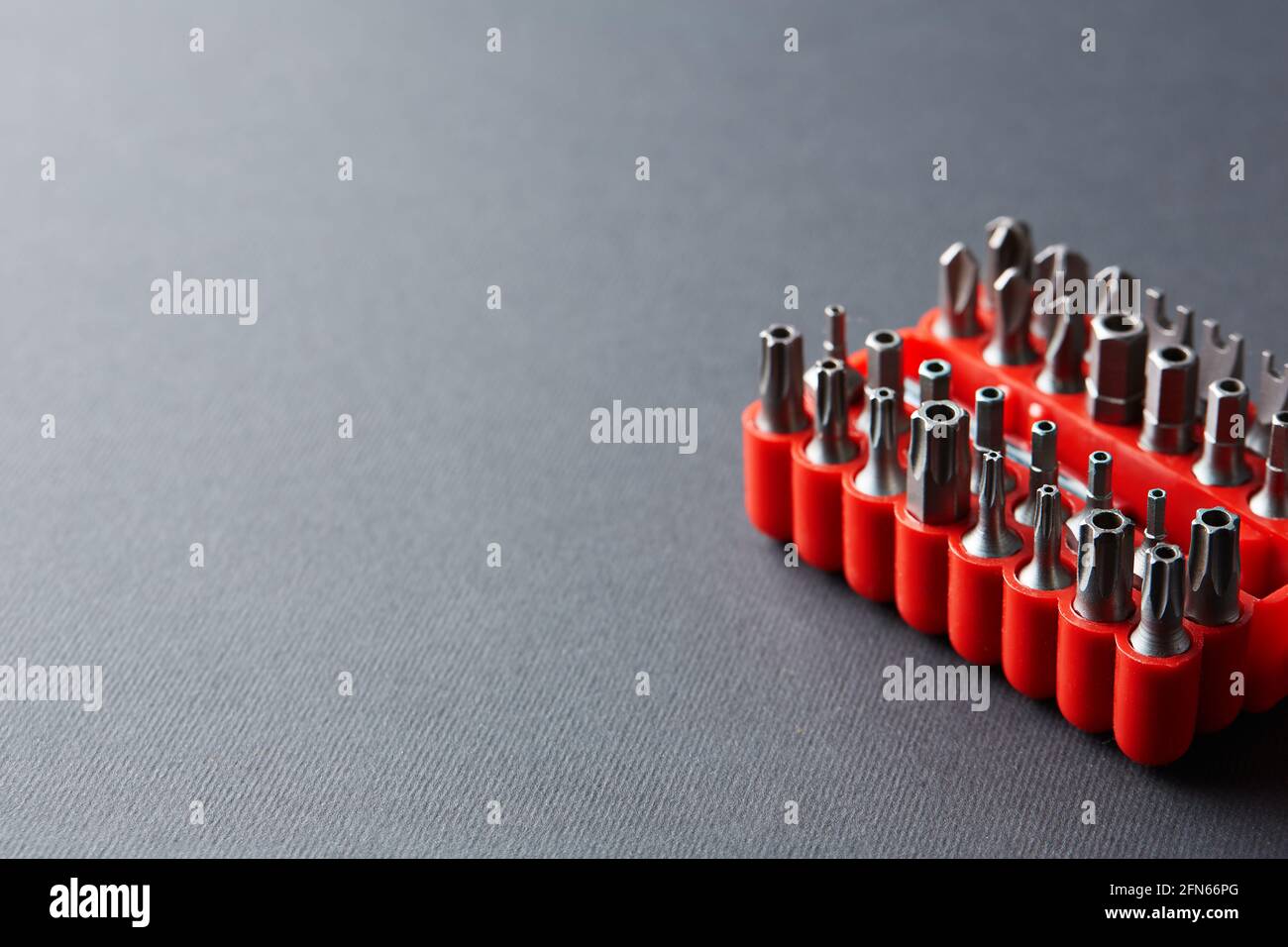 Set of heads for screwdriver. Tools collection. close up, Bits on black ...