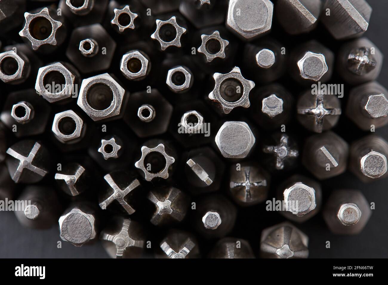 Set of heads for screwdriver. Tools collection. close up, Bits on black ...
