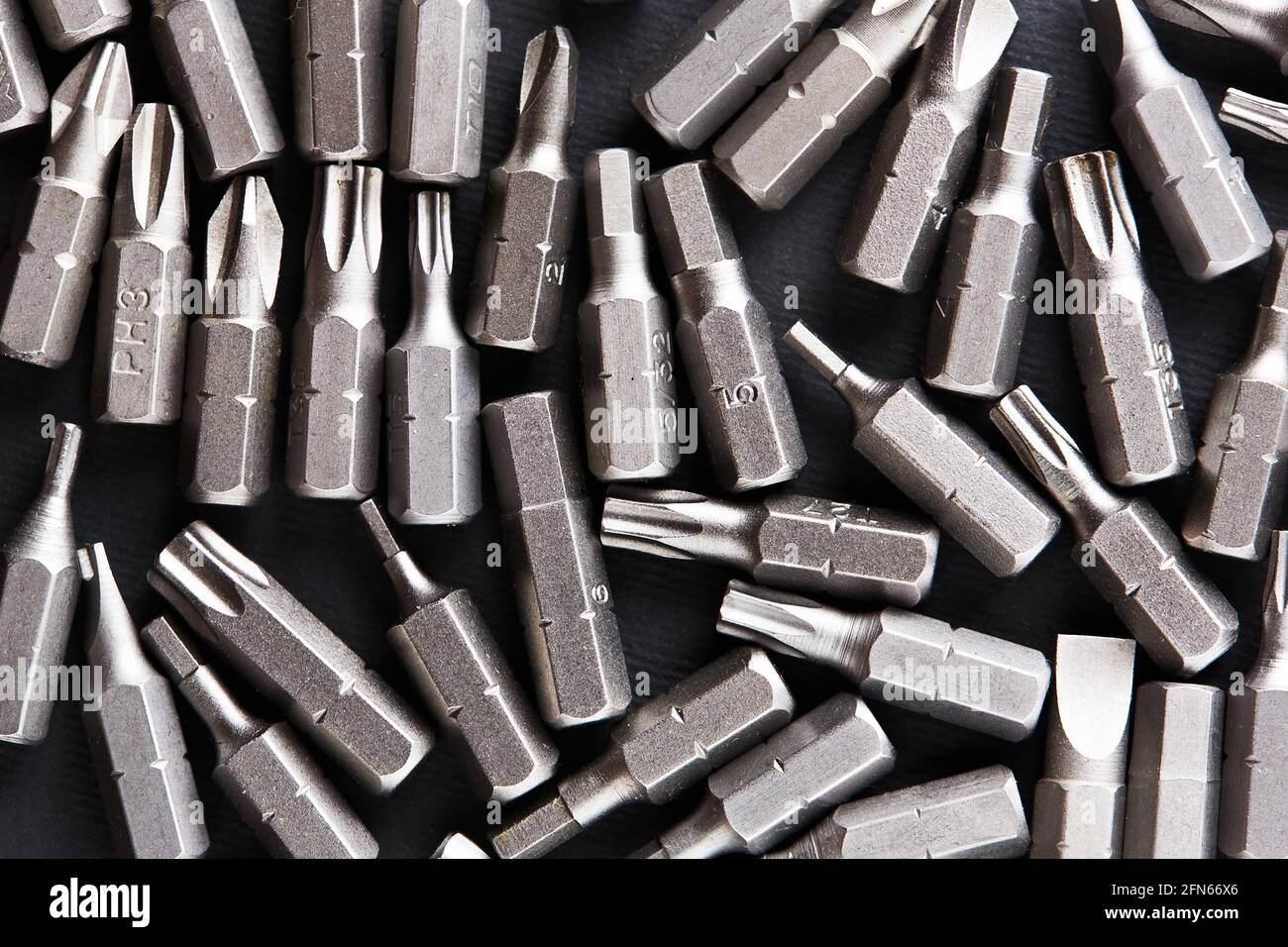 Set of heads for screwdriver. Tools collection. close up, Bits on black ...