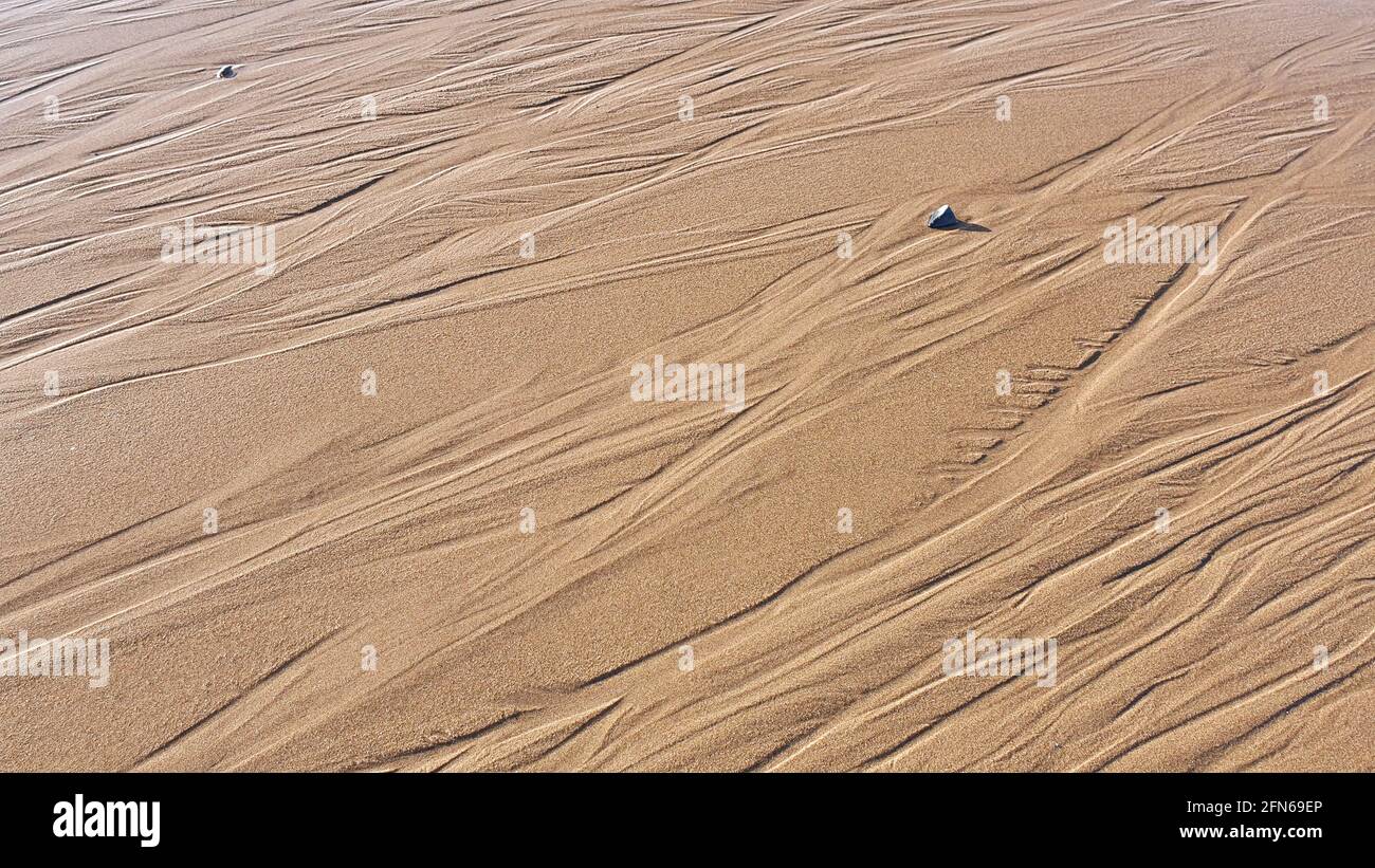 Patterns and textures in sand Stock Photo - Alamy