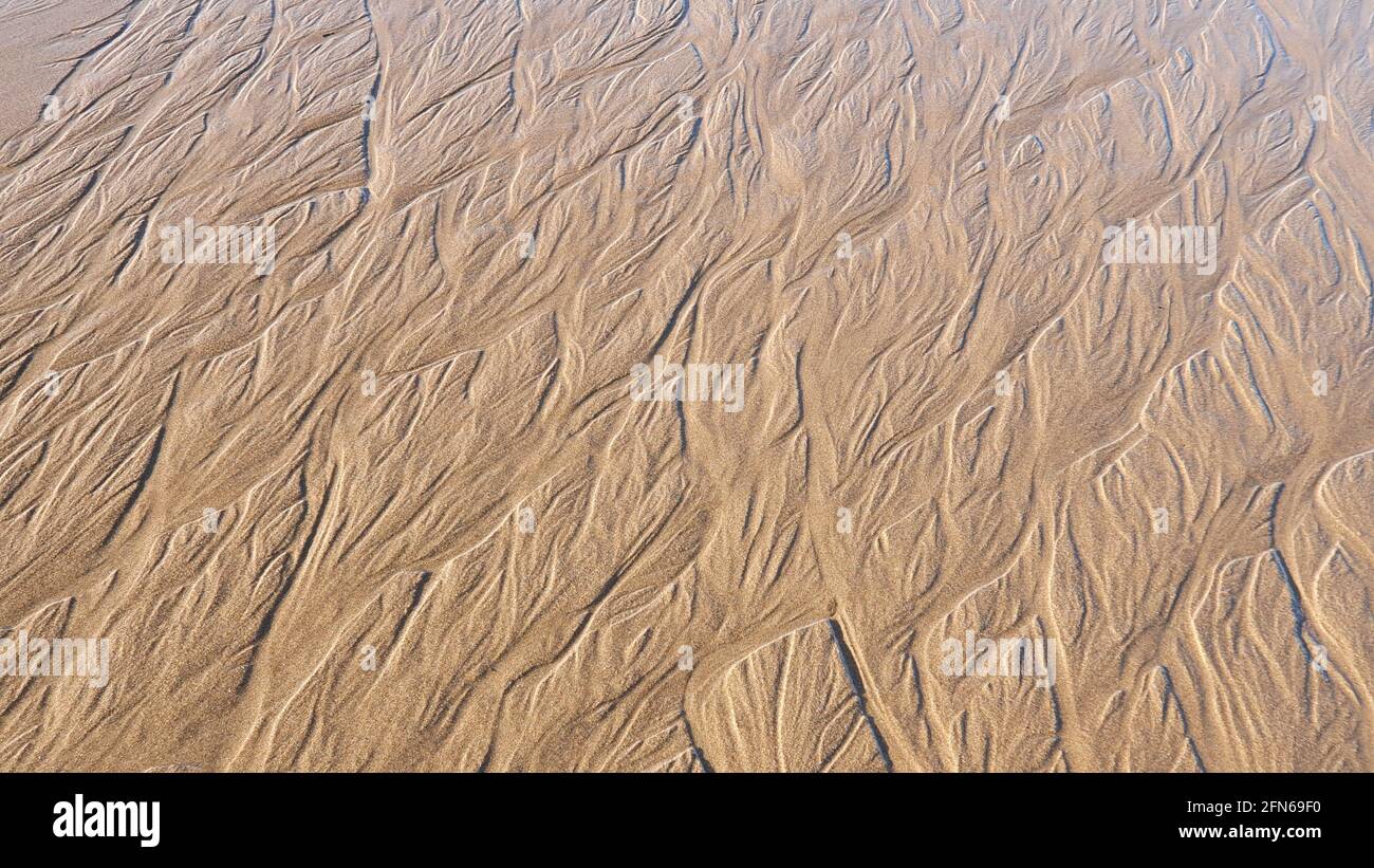 Patterns and textures in sand Stock Photo - Alamy