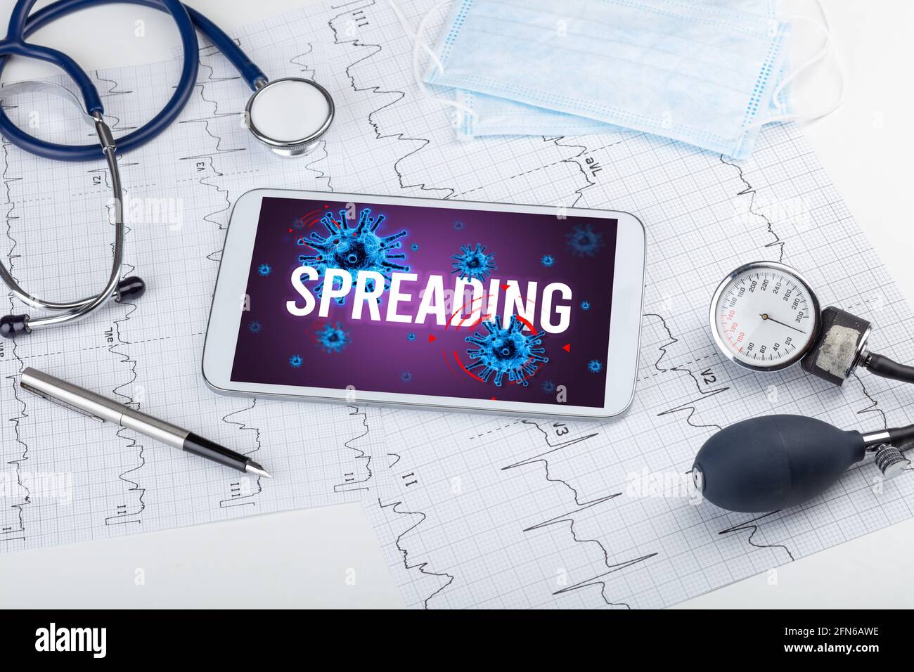 Tablet pc and doctor tools on white surface Stock Photo - Alamy