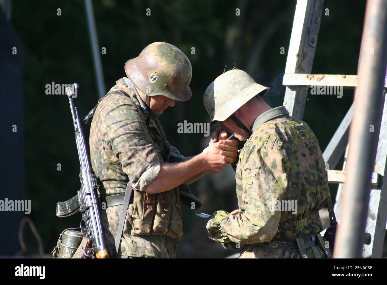 German soldiers lighting up cigarette Stock Photo - Alamy