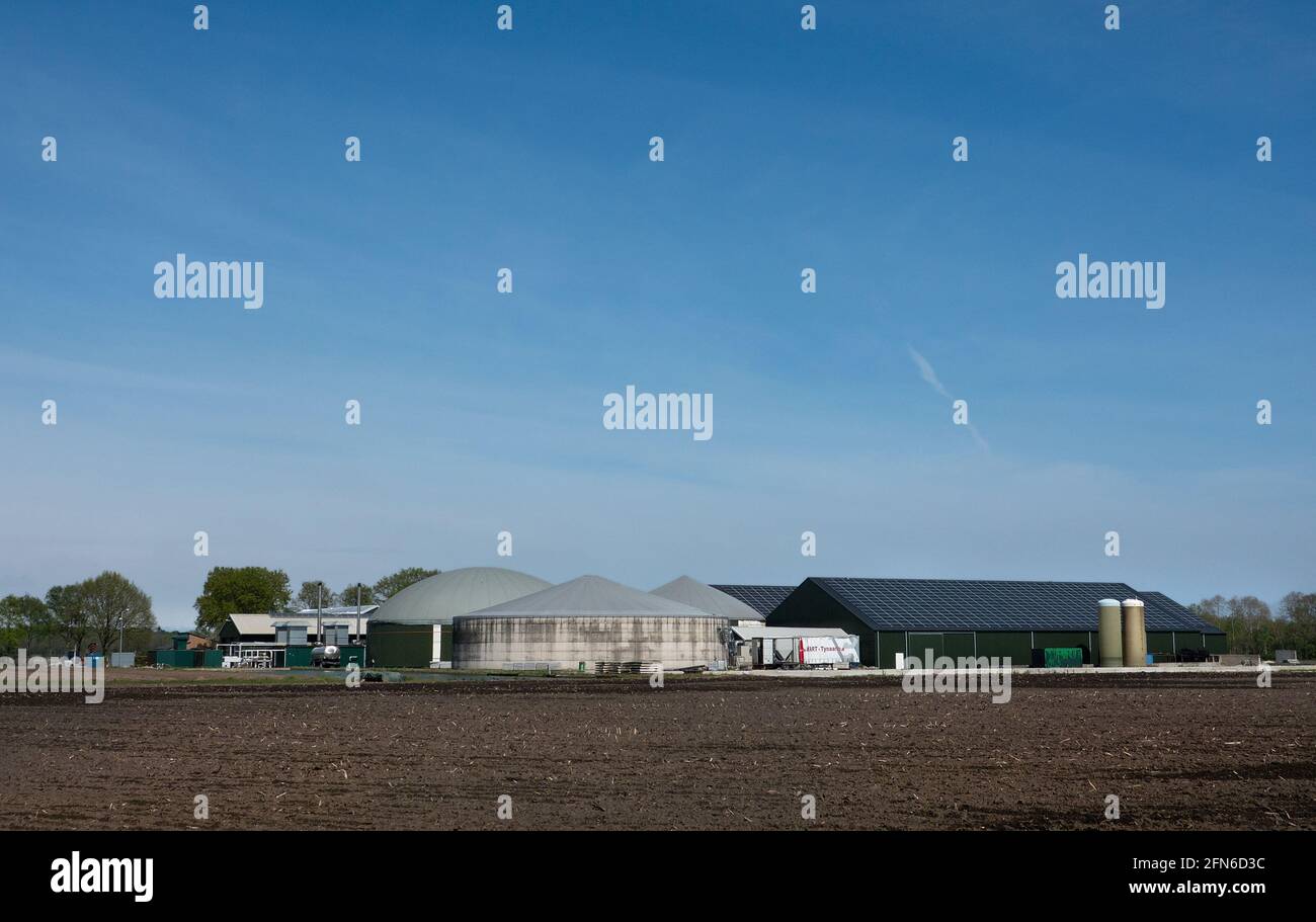 Modern agricultural buildings, sheds with solar panels, storage tanks ...